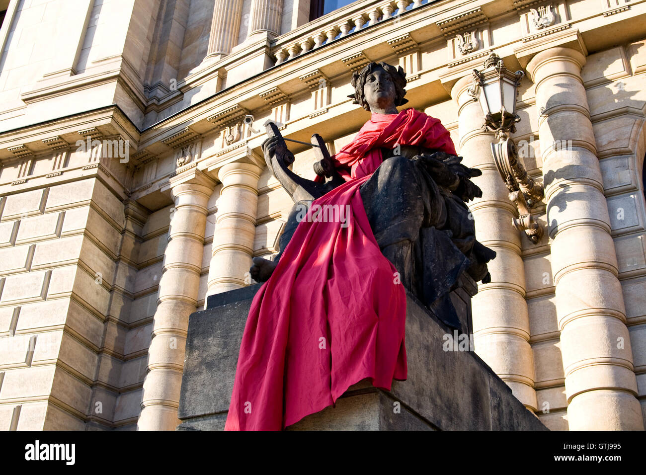 Statue near the Opera House in red cloth, Prague, Czech Republic Stock ...