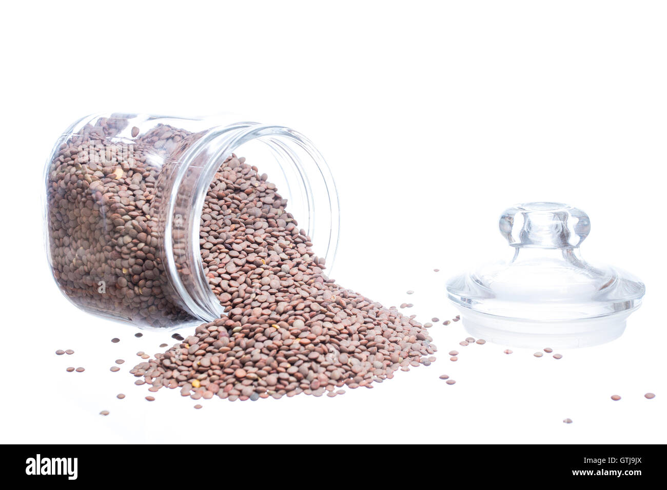 Closeup of lentils jar spilled isolated on white background Stock Photo ...