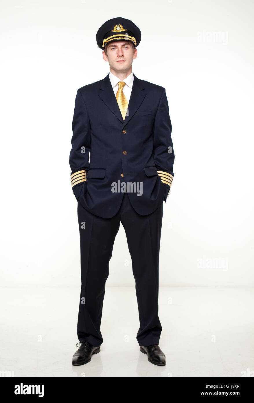 Young man in the form of a passenger plane pilot Stock Photo - Alamy