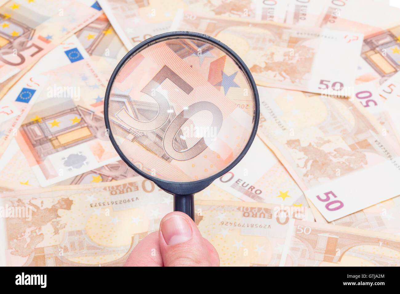 Closeup of fifty euro notes through magnifer background Stock Photo - Alamy