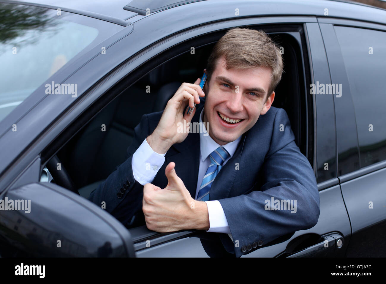 young attractive man calling by phone Stock Photo - Alamy