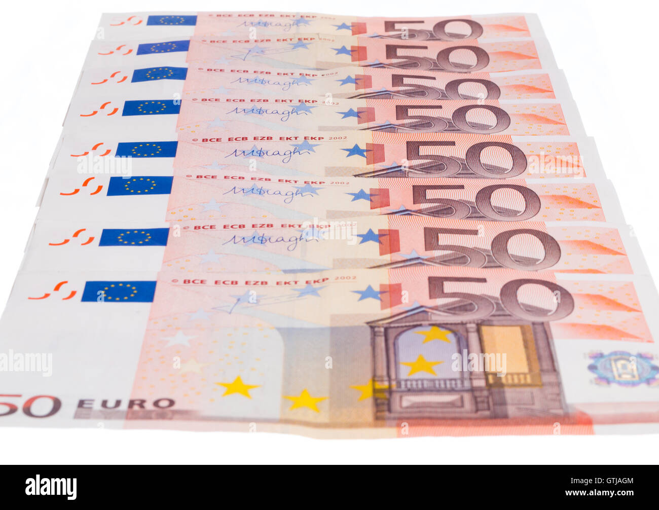 Fifty euro notes row isolated on white background Stock Photo - Alamy