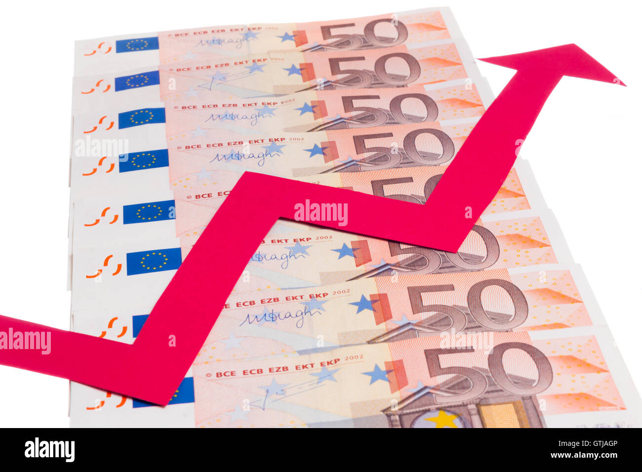 Concept of increase of euro value with red arrow growing over notes row ...