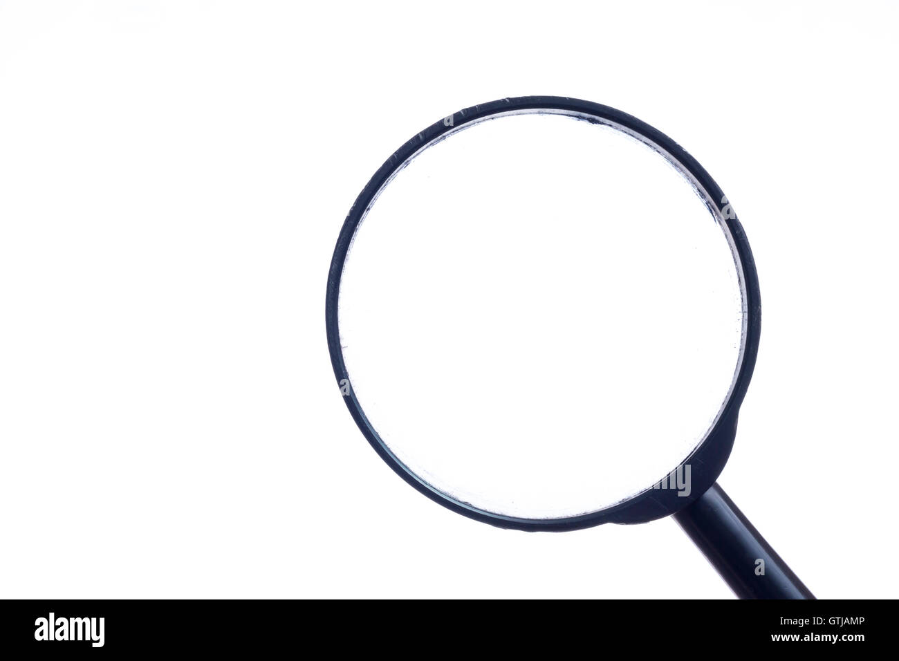 Closeup of a magnifier isolated on white background Stock Photo - Alamy
