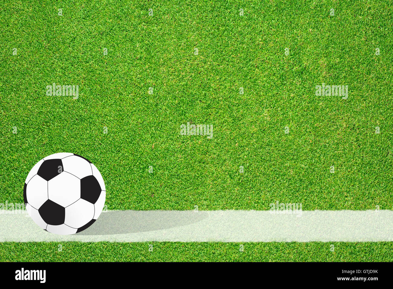 Football soccer on grass background Stock Photo - Alamy