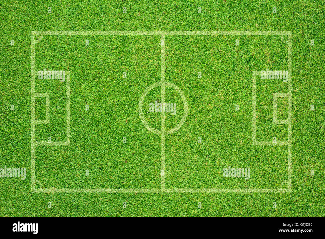 Soccer football on grass field Stock Photo - Alamy