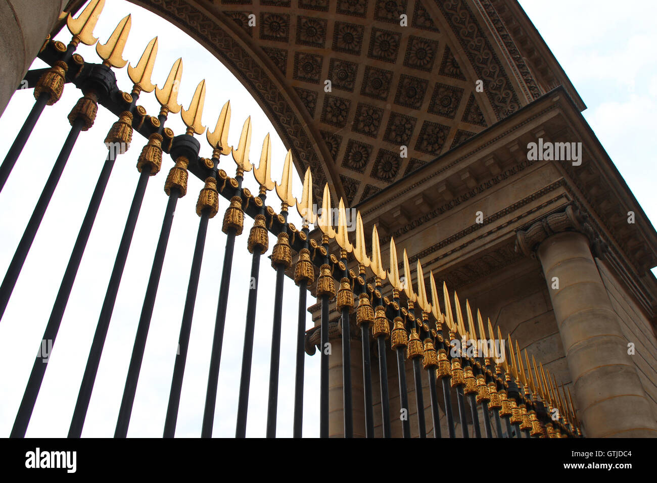 A metallic rail and a gate in front of the Salm mansion in Paris ...