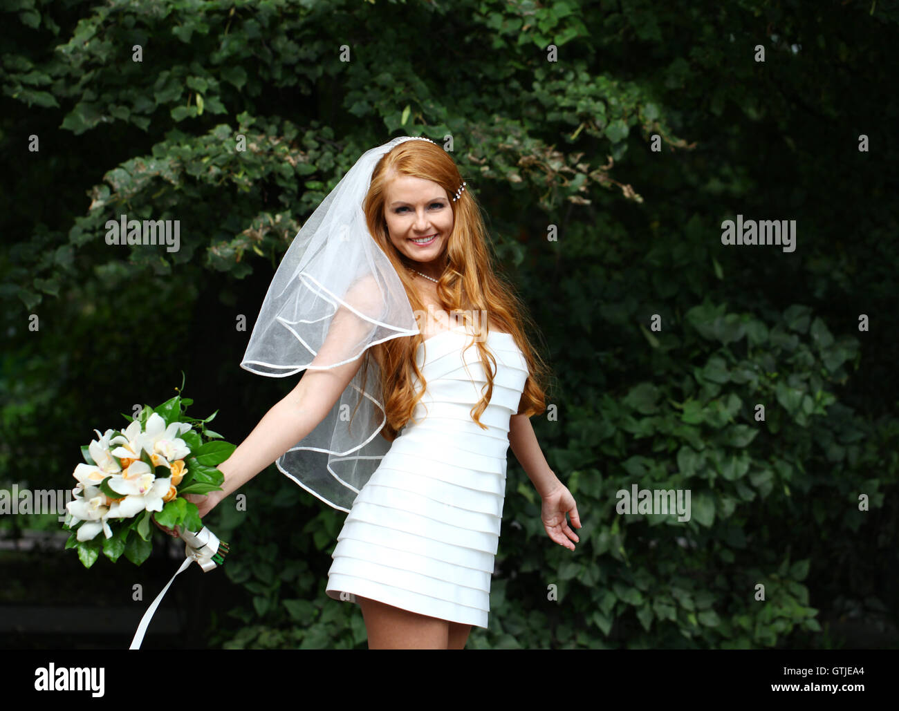Beautiful red hair bride wearing wedding dress Stock Photo - Alamy