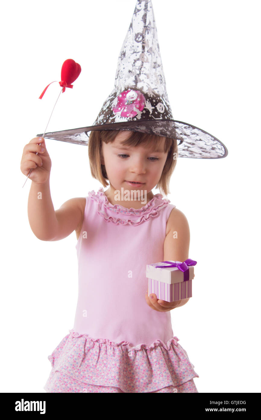 Girl making magic with wand Stock Photo - Alamy