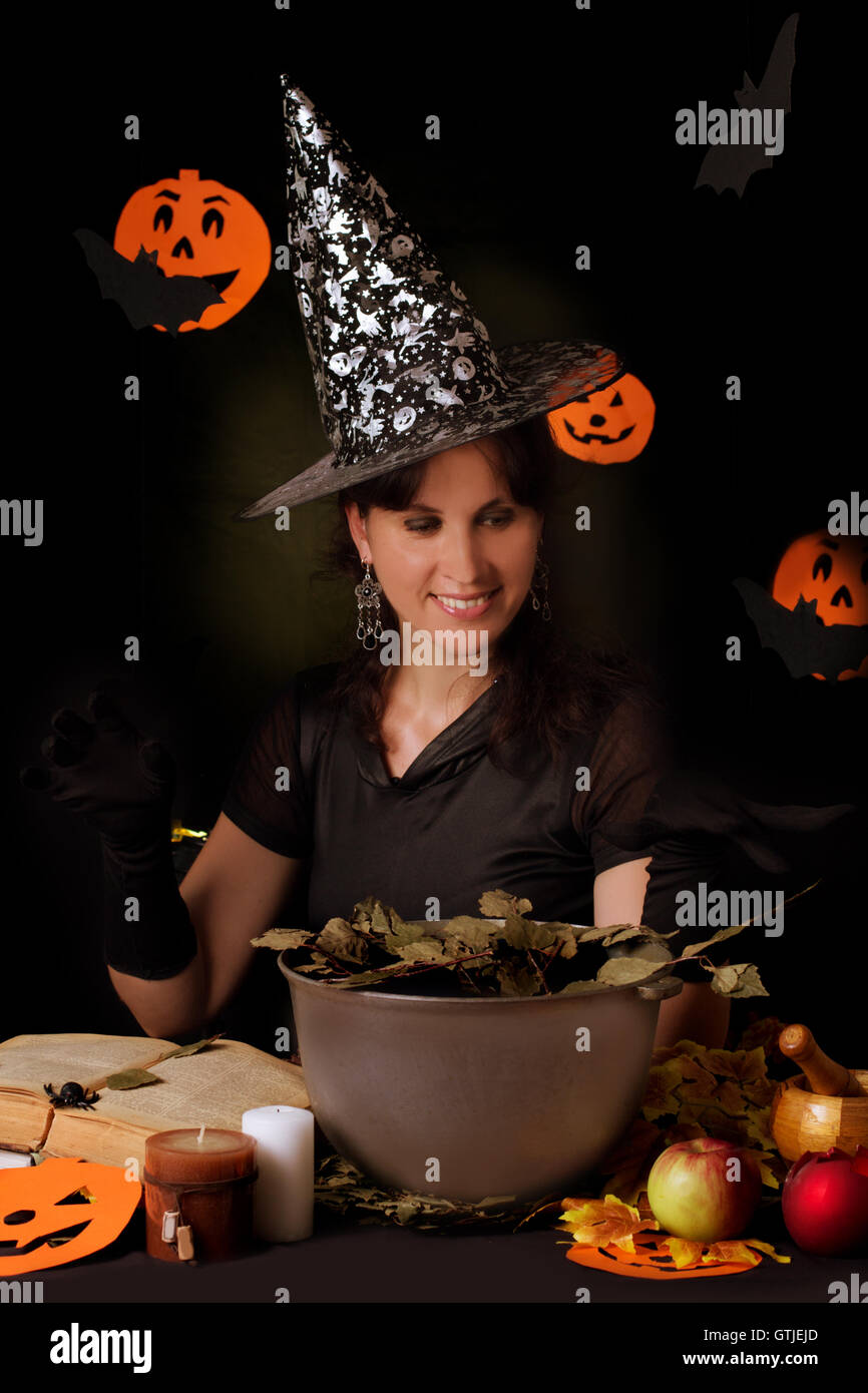 Witch practicing sorcery at Halloween night Stock Photo - Alamy