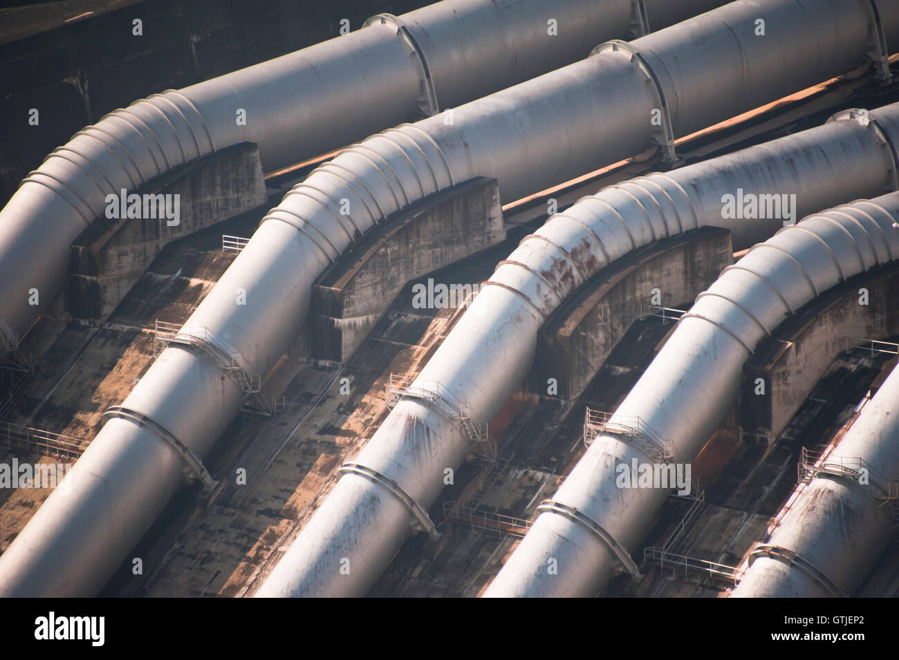 Water pipe line of dam in thailand Stock Photo - Alamy