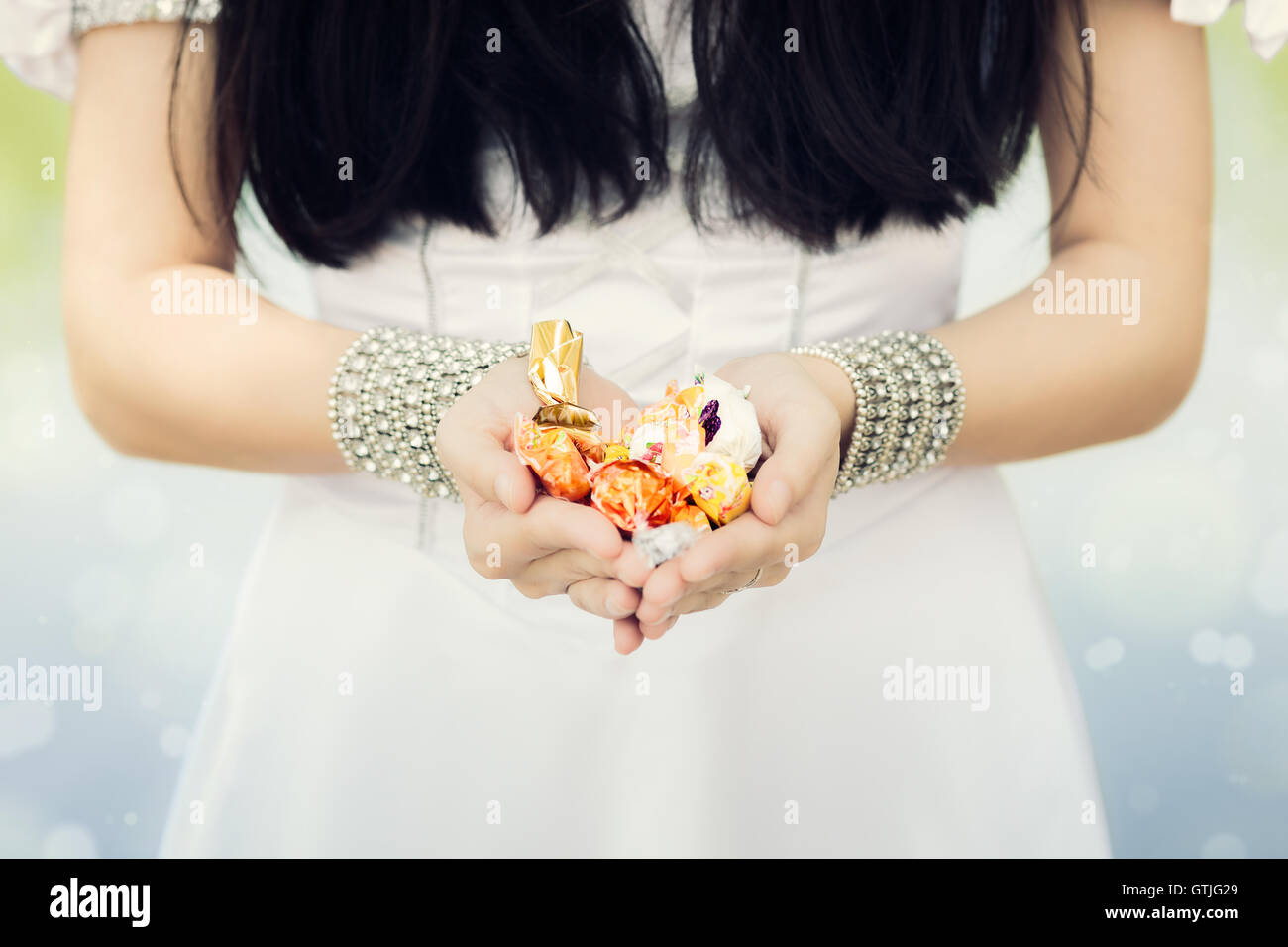 Girl's Hands Holding Candy Stock Photo - Alamy