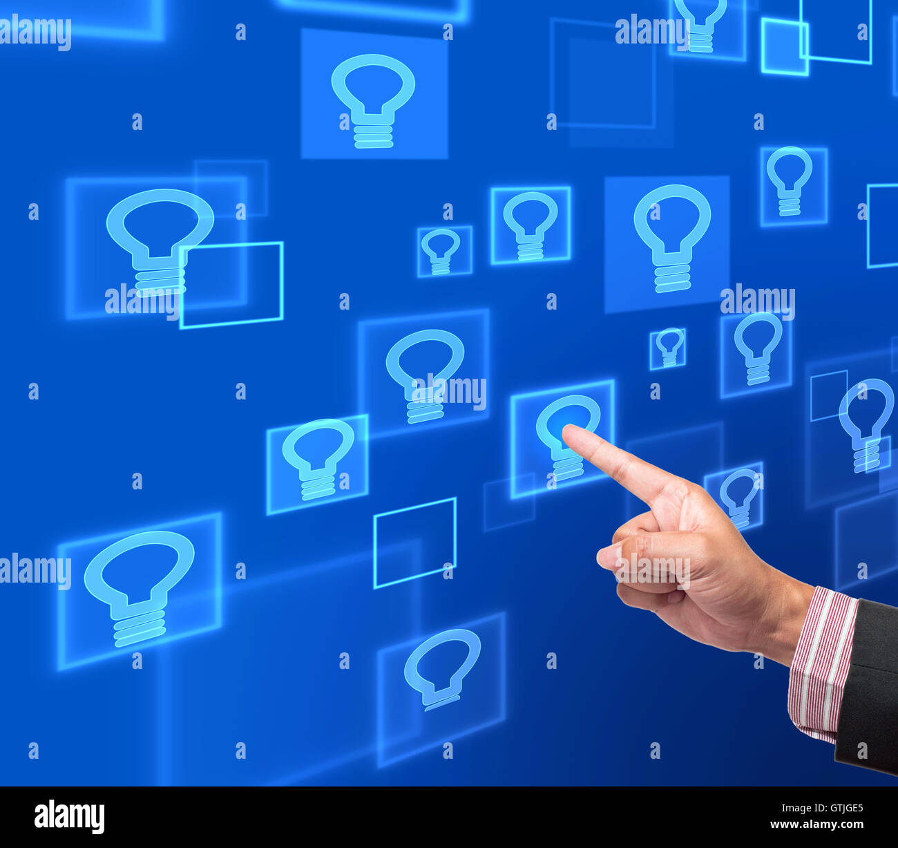 Hand pushing bulb light button on a touch screen interface Stock Photo ...