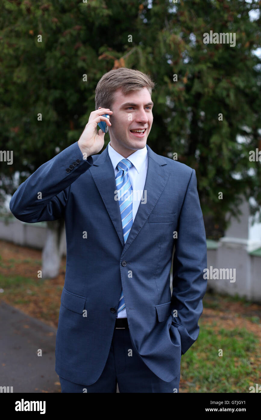 young attractive man calling by phone Stock Photo - Alamy
