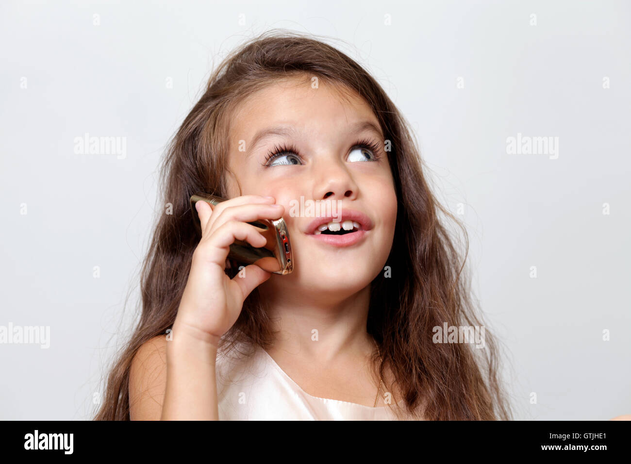 little girl calling by phone Stock Photo - Alamy