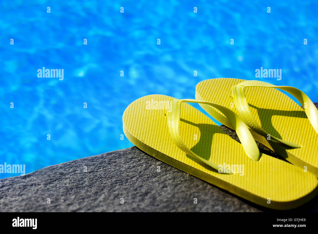 sandals by a pool Stock Photo - Alamy