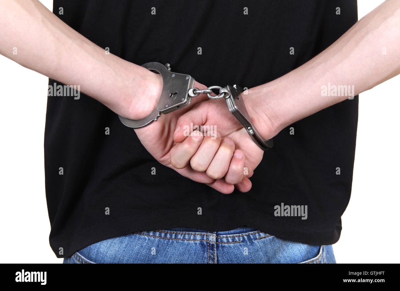 Handcuffs on Hands closeup Stock Photo - Alamy