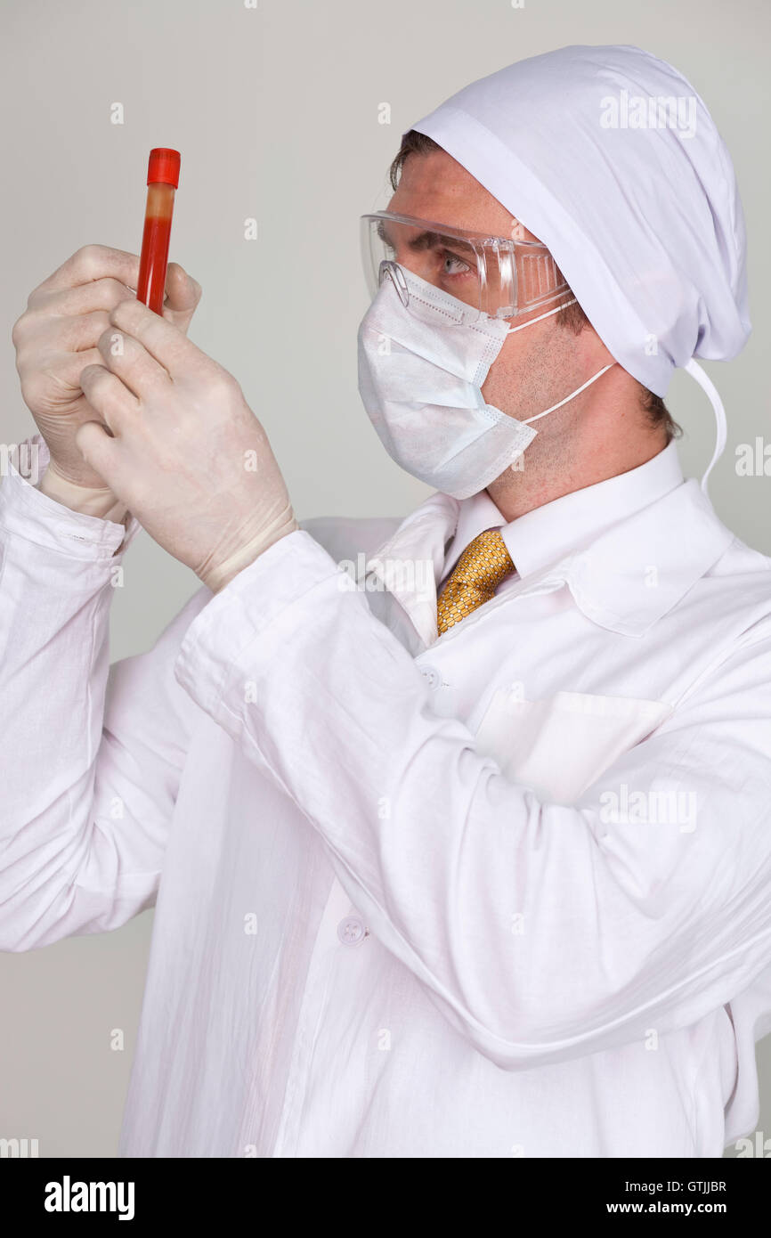 Doctor holding a beaker of blood Stock Photo - Alamy