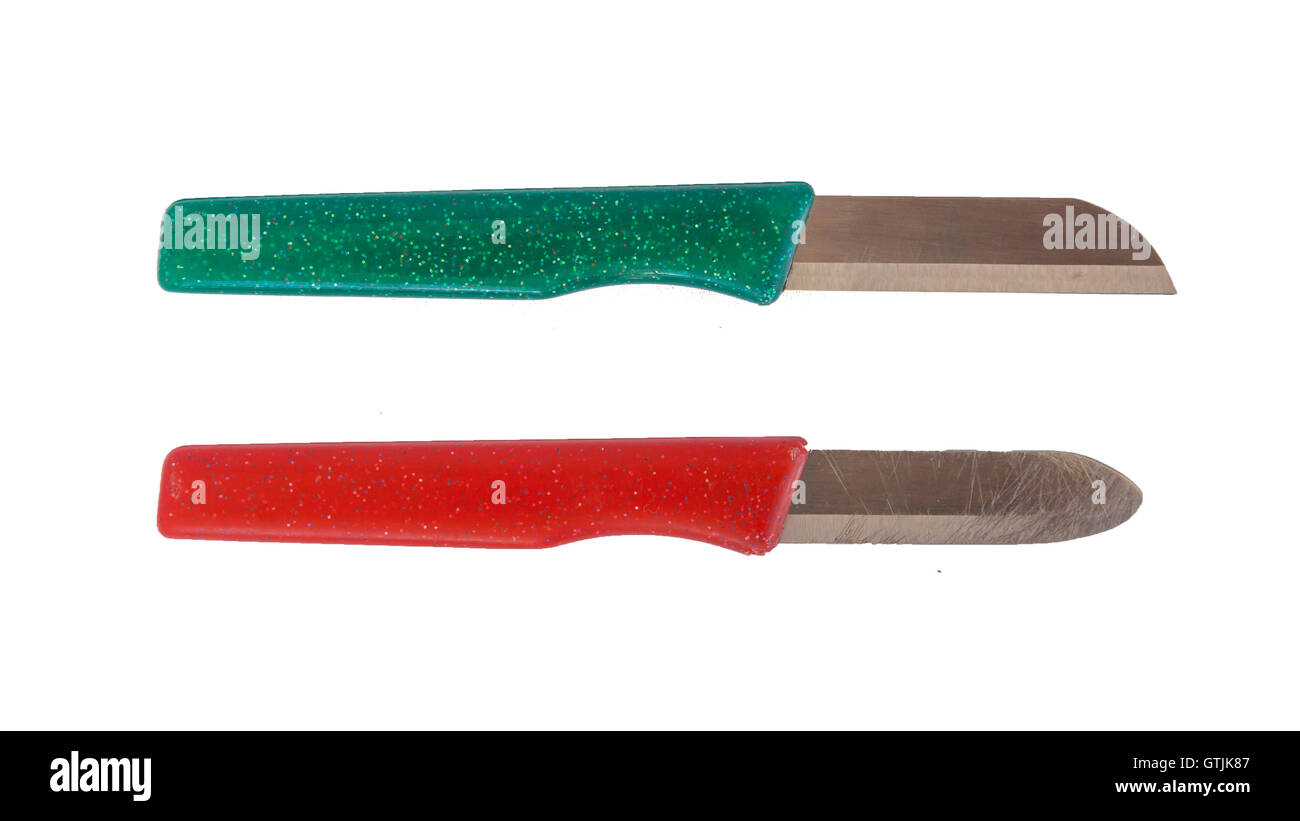 Two kitchen knifes red and green handles, new and used Stock Photo - Alamy