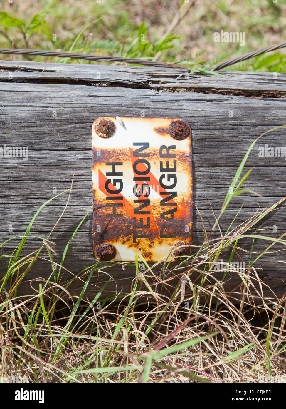 High tension danger sign on a pole Stock Photo - Alamy