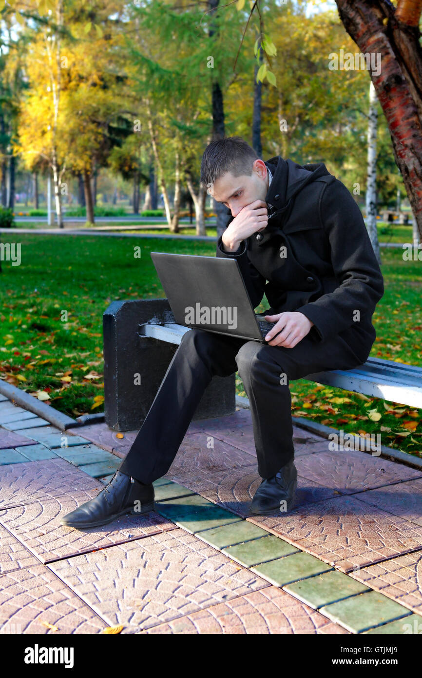 Man with Laptop Outdoor Stock Photo - Alamy