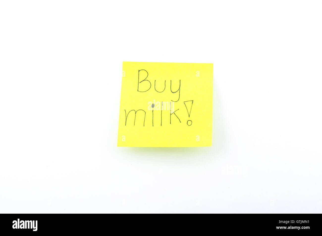 buy milk text on yellow post it Stock Photo - Alamy