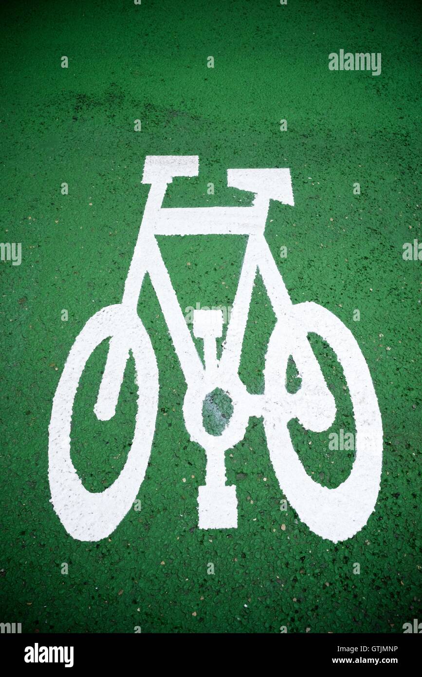 Bike lane sign painted on a street Stock Photo - Alamy