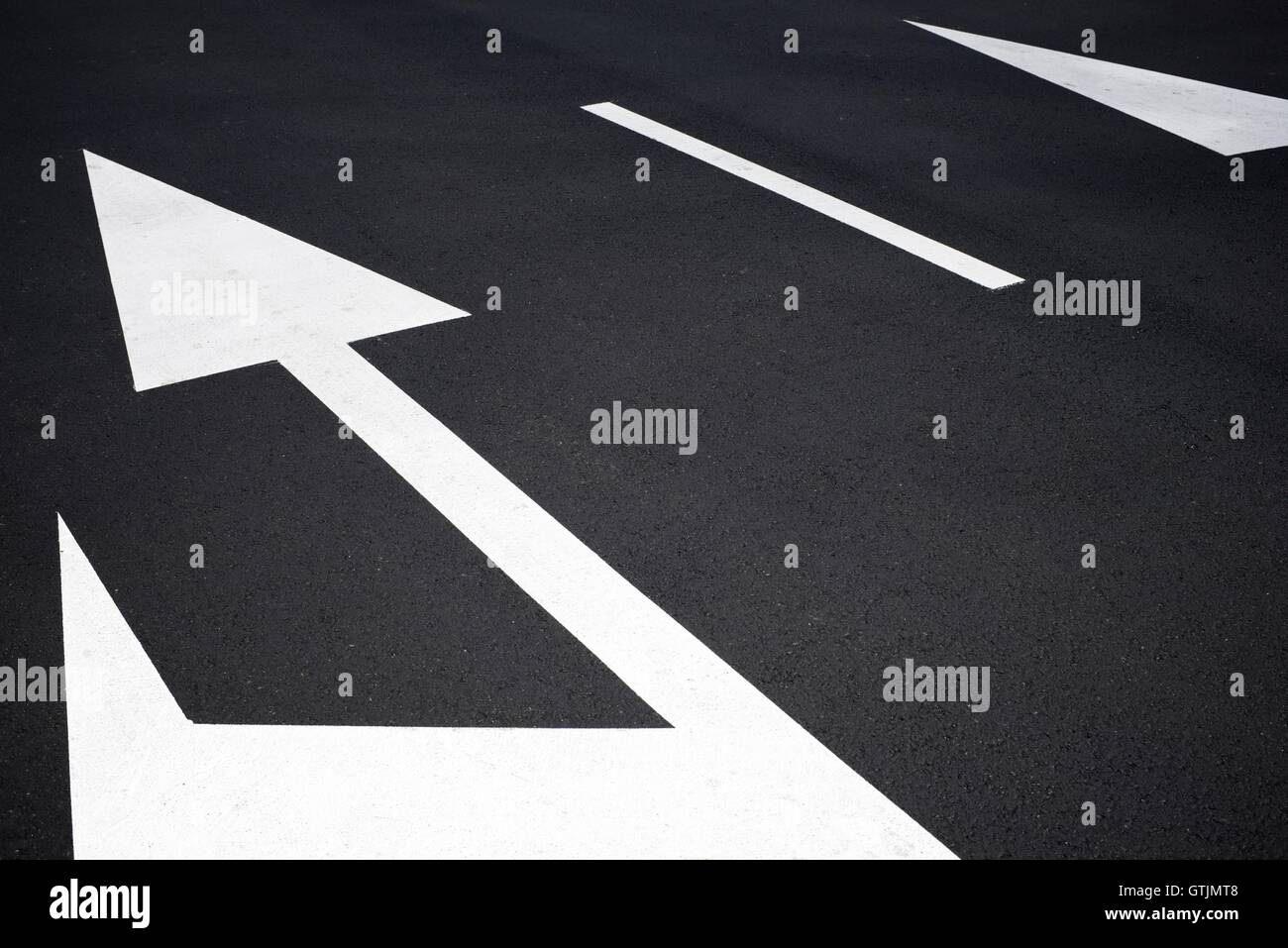 Traffic signs painted on the road Stock Photo - Alamy
