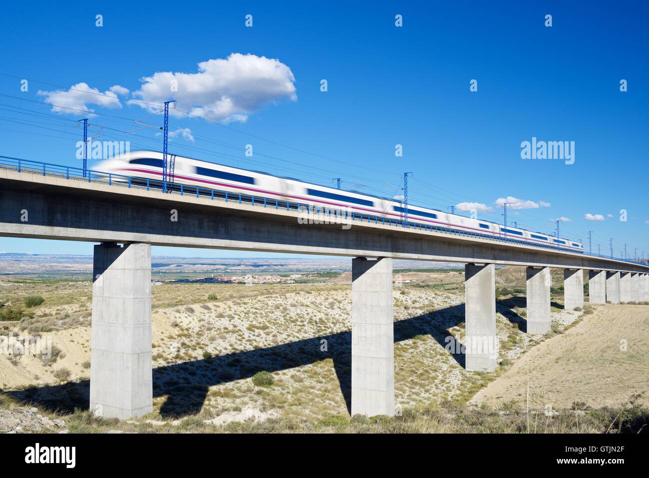 view of a high-speed train crossing a viaduct in Roden, Zaragoza ...