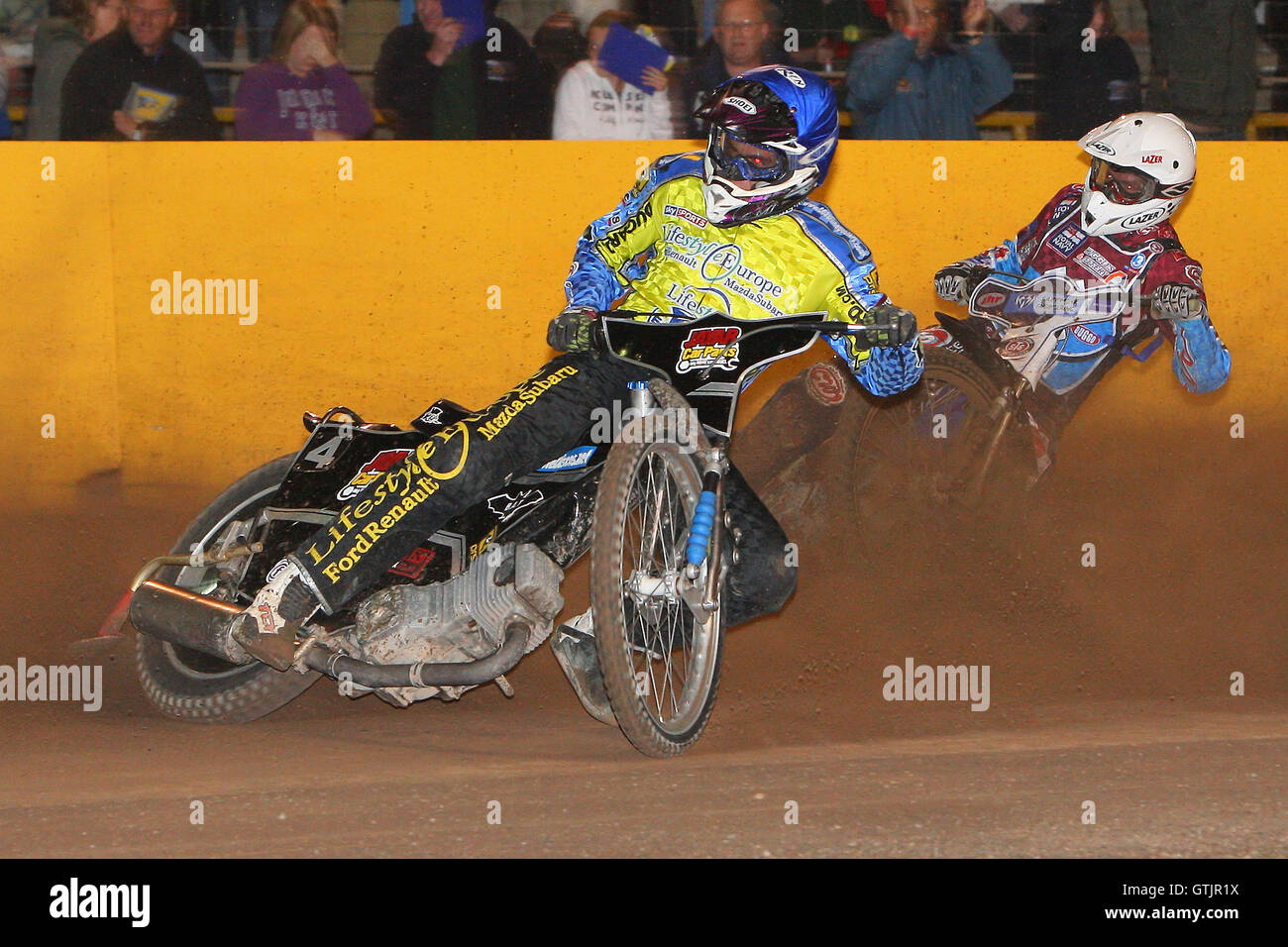 Heat 3: Lewis Bridger (blue) ahead of Stuart Robson - Eastbourne Eagles ...