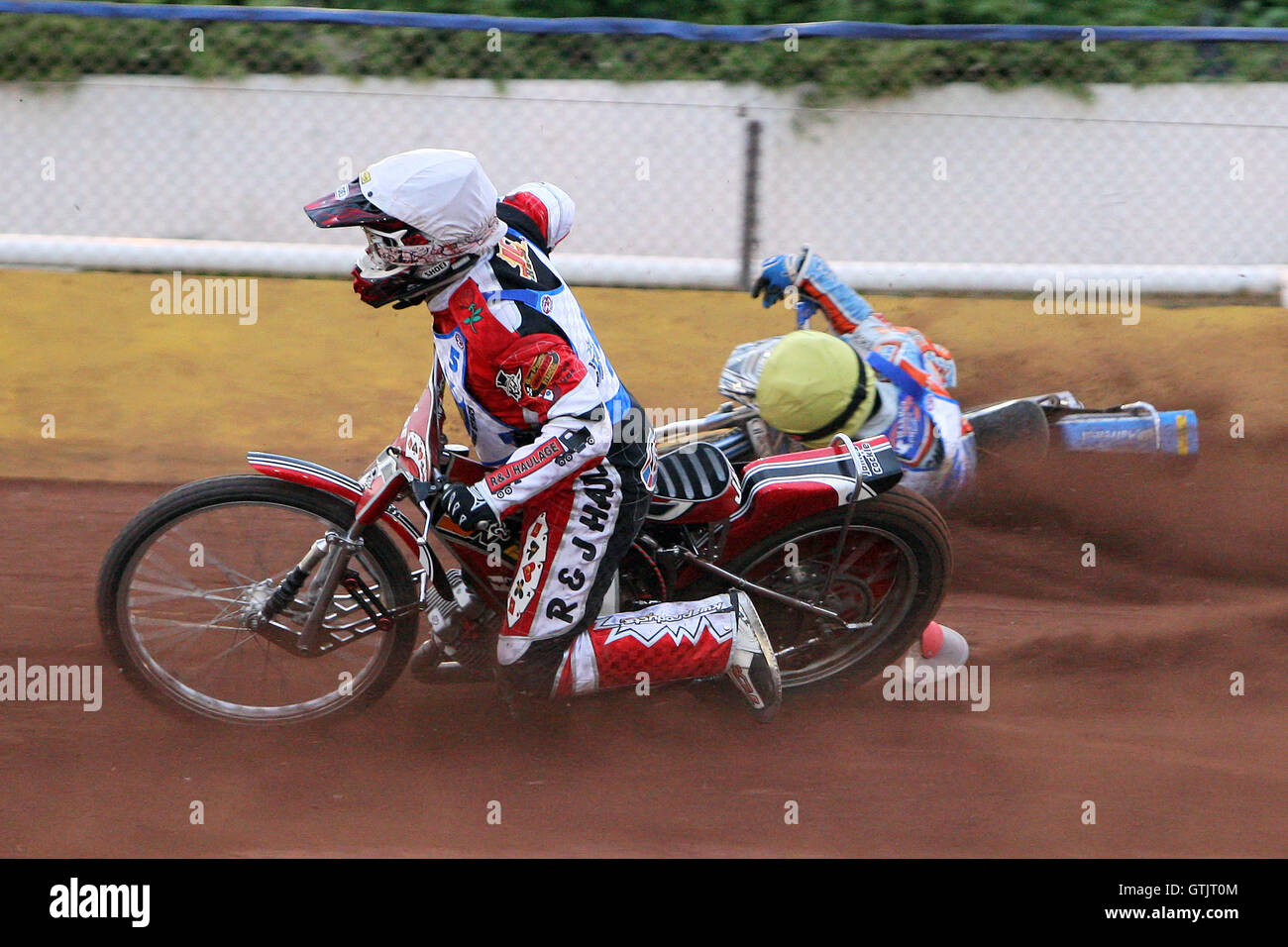 Heat 9: James Cockle (white) rides past as Tom Stokes crashes out ...
