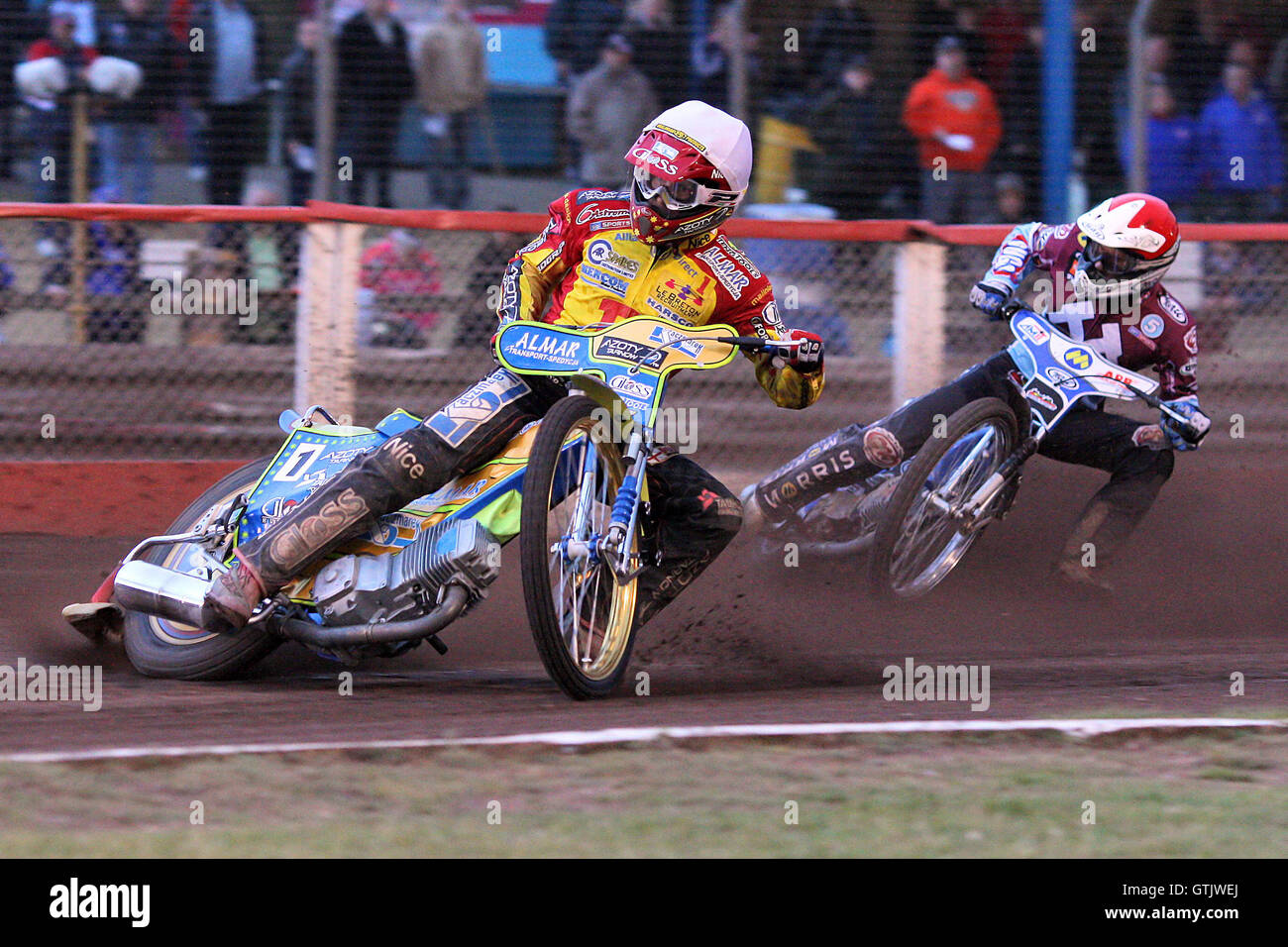 Heat 11: Piotr Swiderski (red) chases down Krzysztof Kasprzak ...