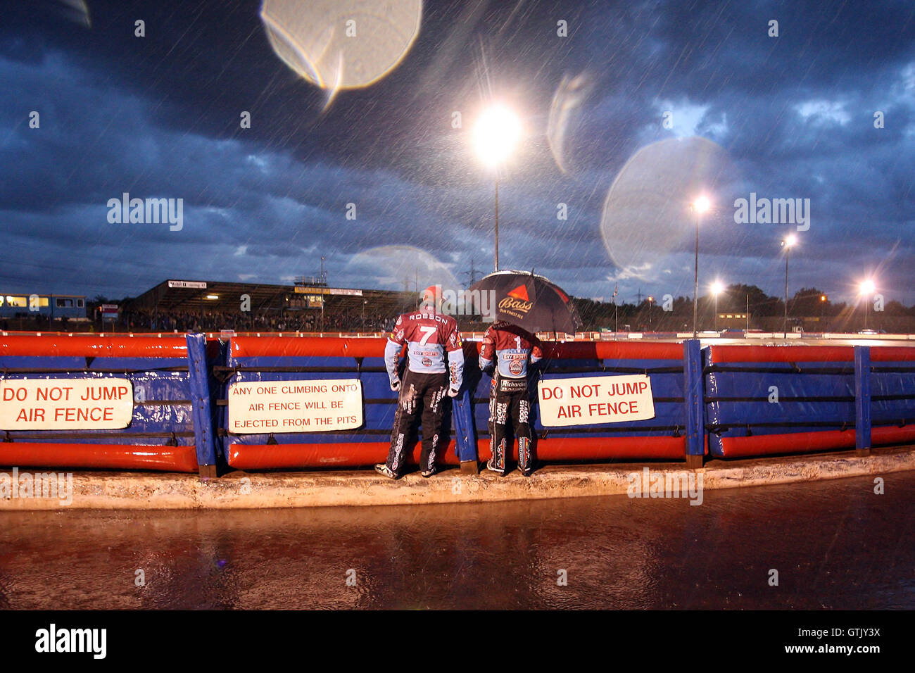 Stuart Robson (L) and Lee Richardson look at the track during a ...