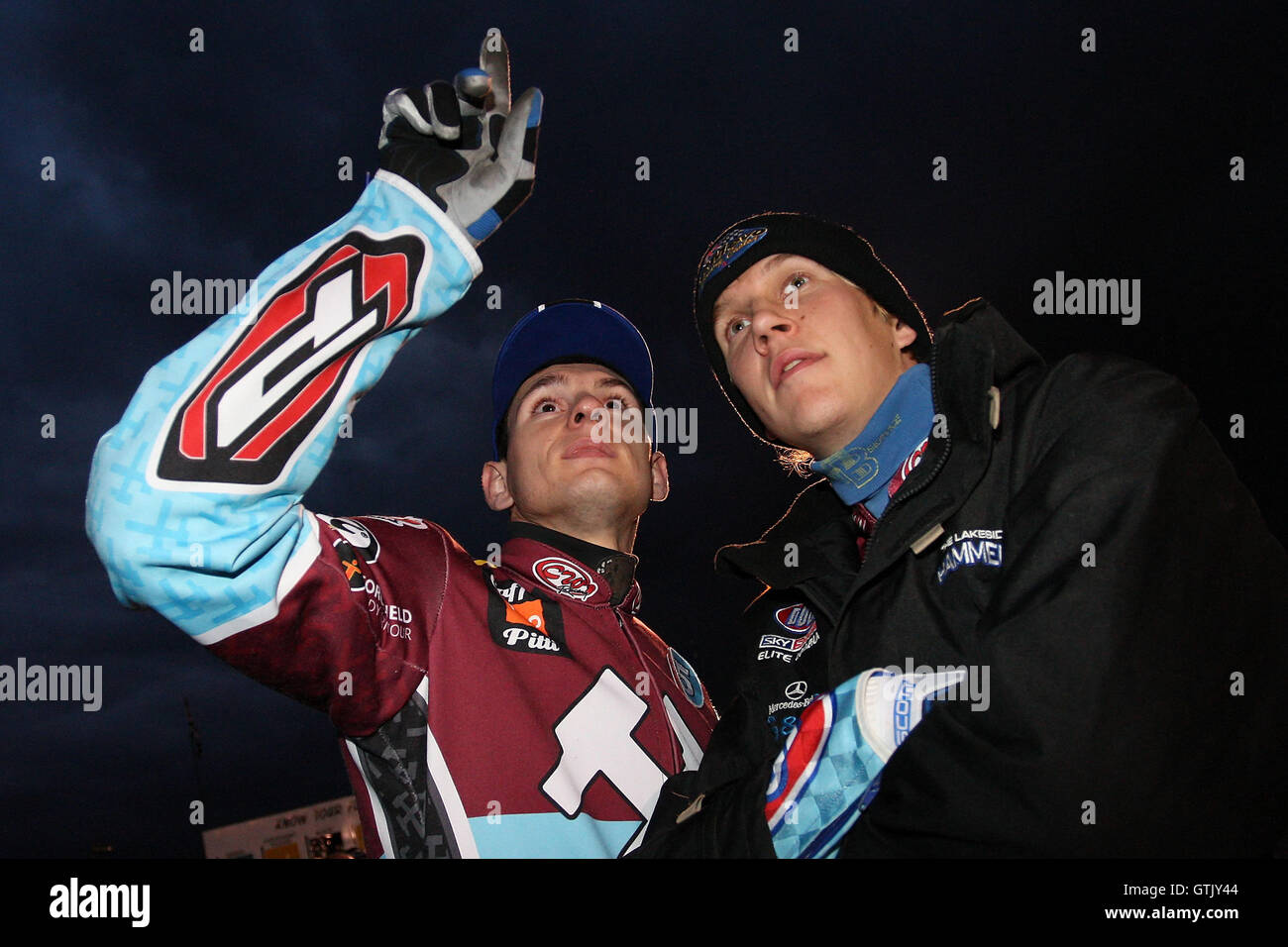 Piotr Swiderski (L) and Kauko Nieminen look to the skies as the meeting ...