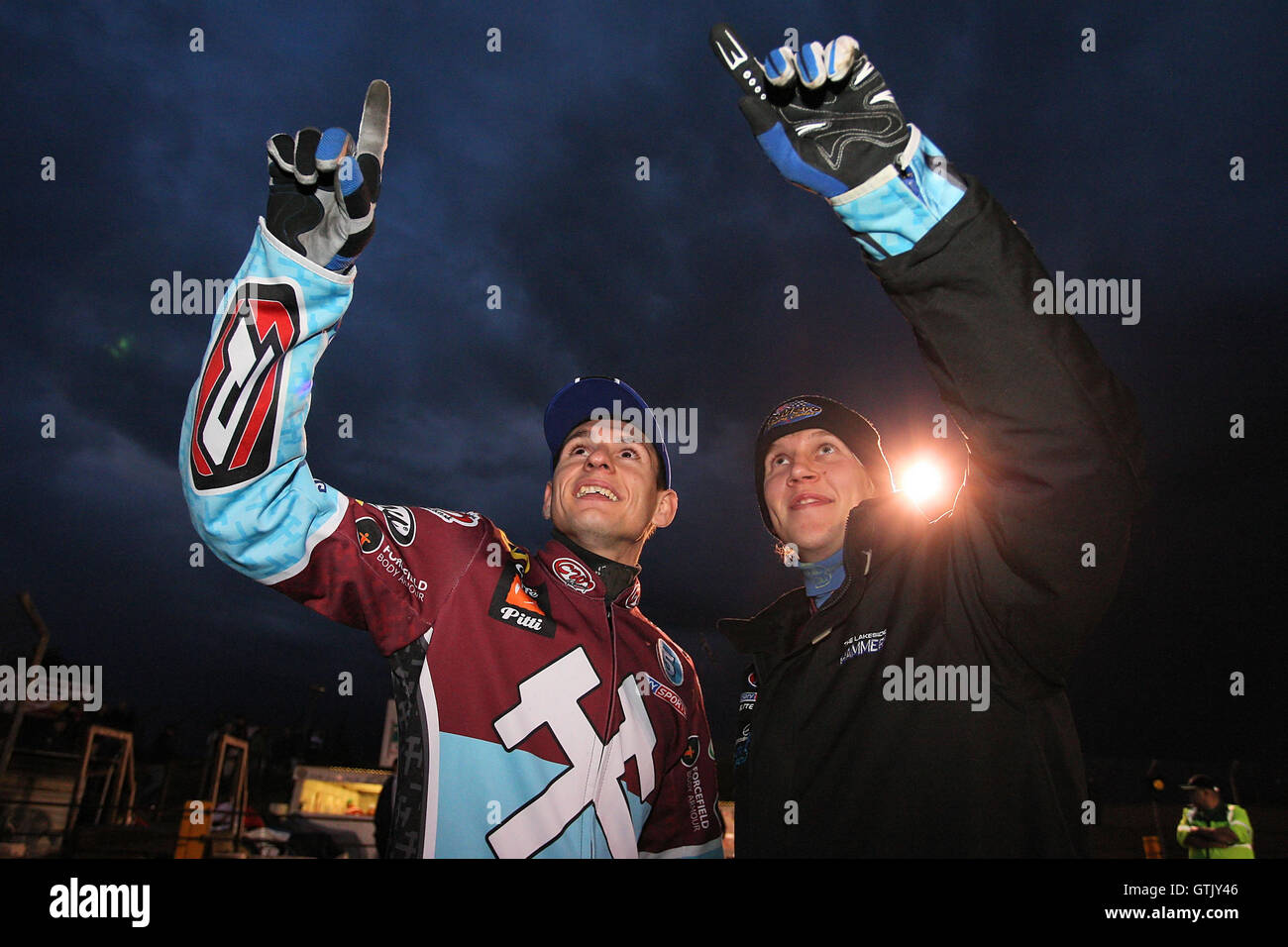Piotr Swiderski (L) and Kauko Nieminen look to the skies as the meeting ...