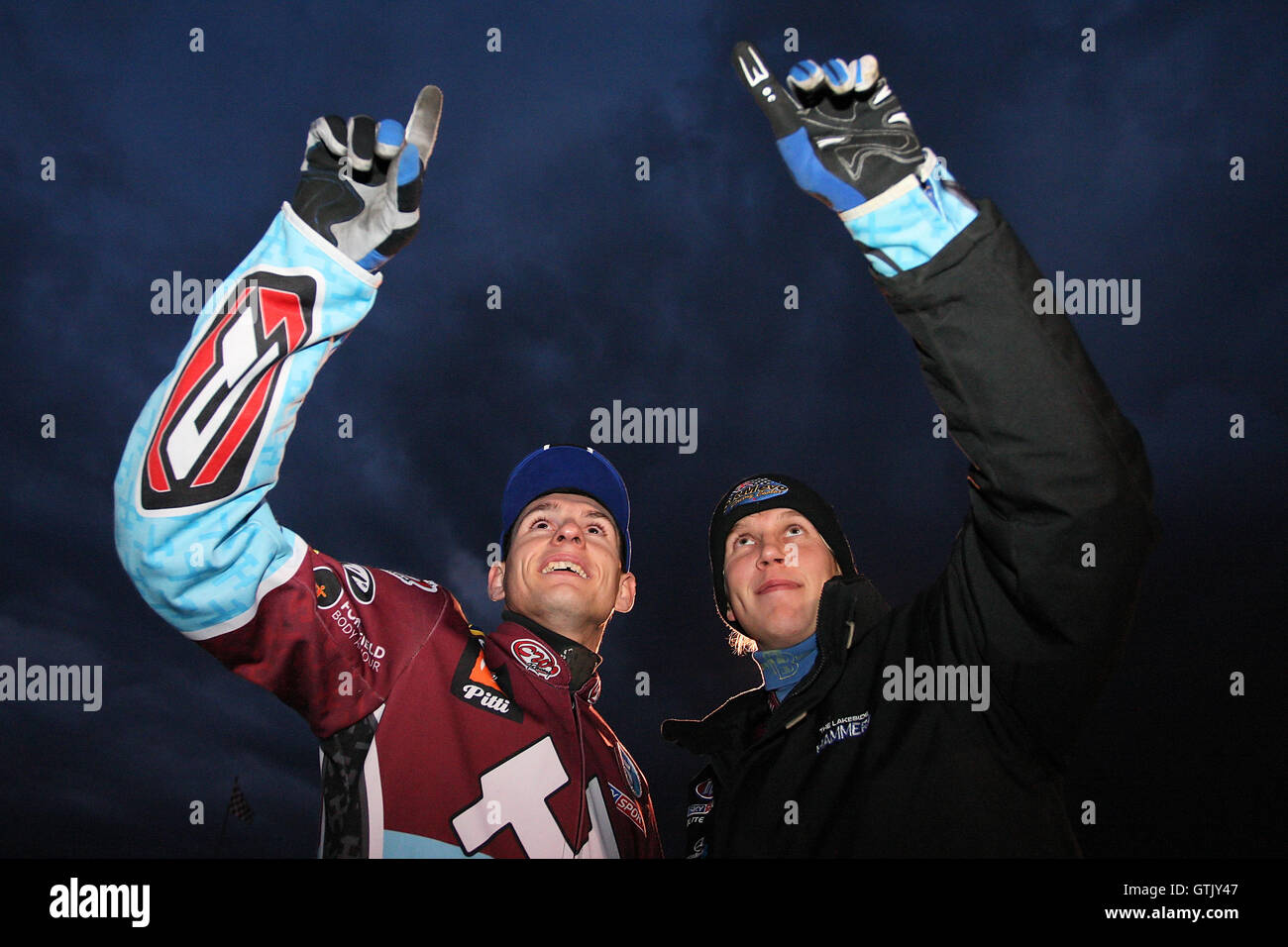 Piotr Swiderski (L) and Kauko Nieminen look to the skies as the meeting ...