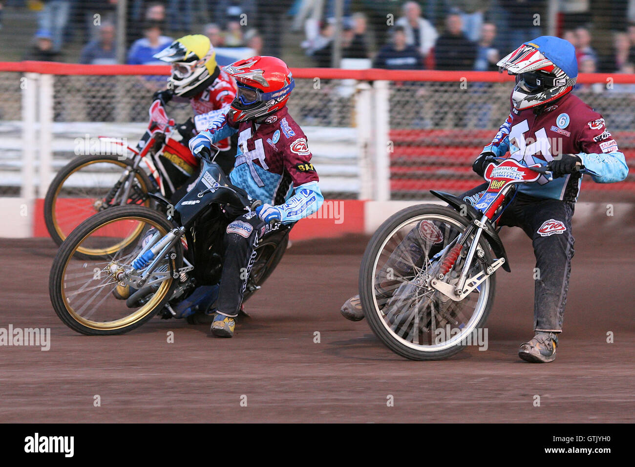 Heat 14: Jonas Davidsson (red), Phil Morris (blue) and Kenneth Hansen ...