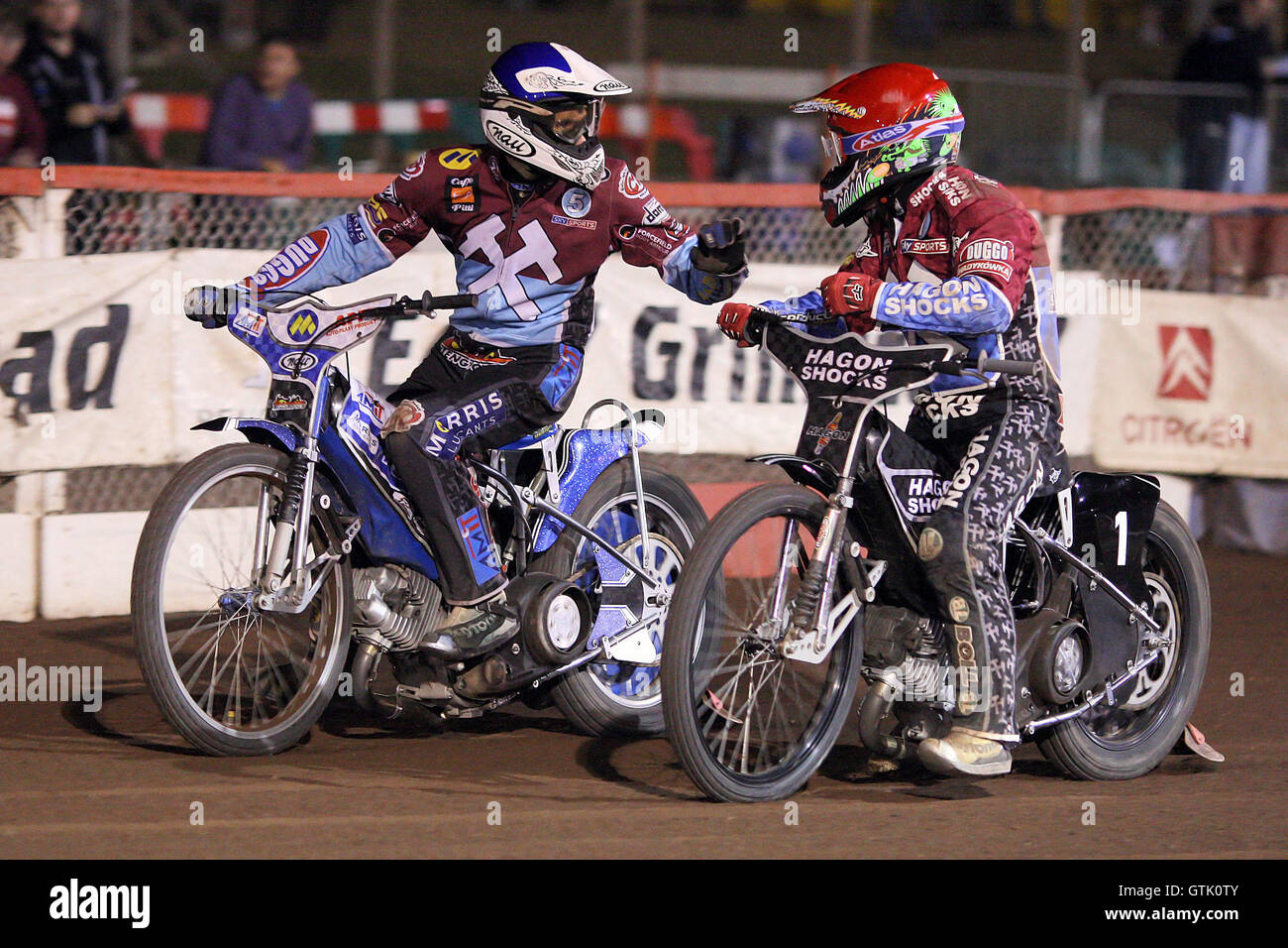 Heat 13: Piotr Swiderski (blue) and Lee Richardson celebrate a 5-1 ...