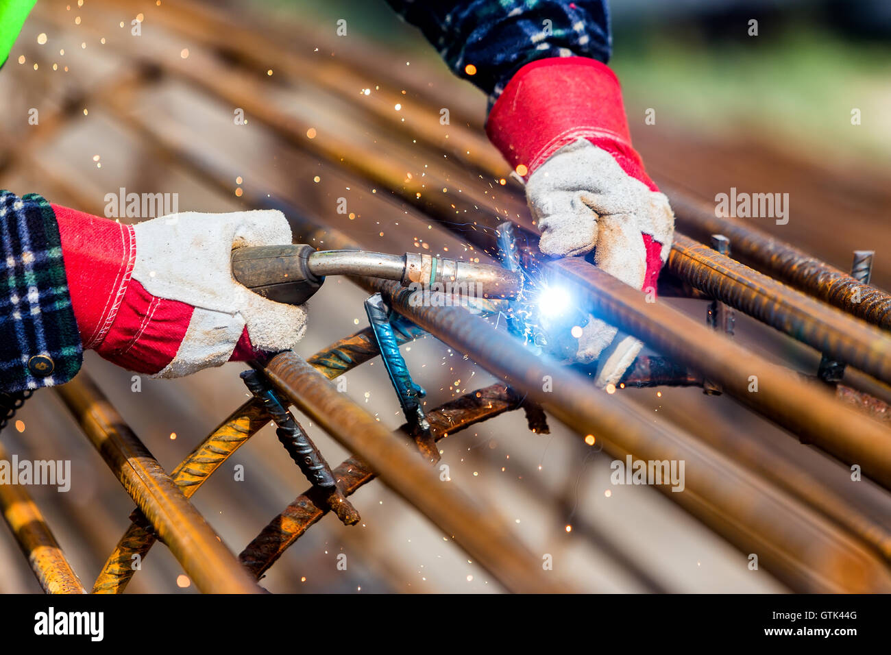 Close up of the hands welder worker with electrode. selective focus ...