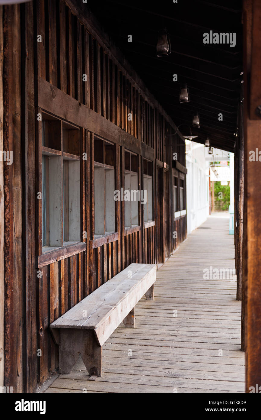 rustic wooden sidewalk with old bench in Winthrop, Washington state ...