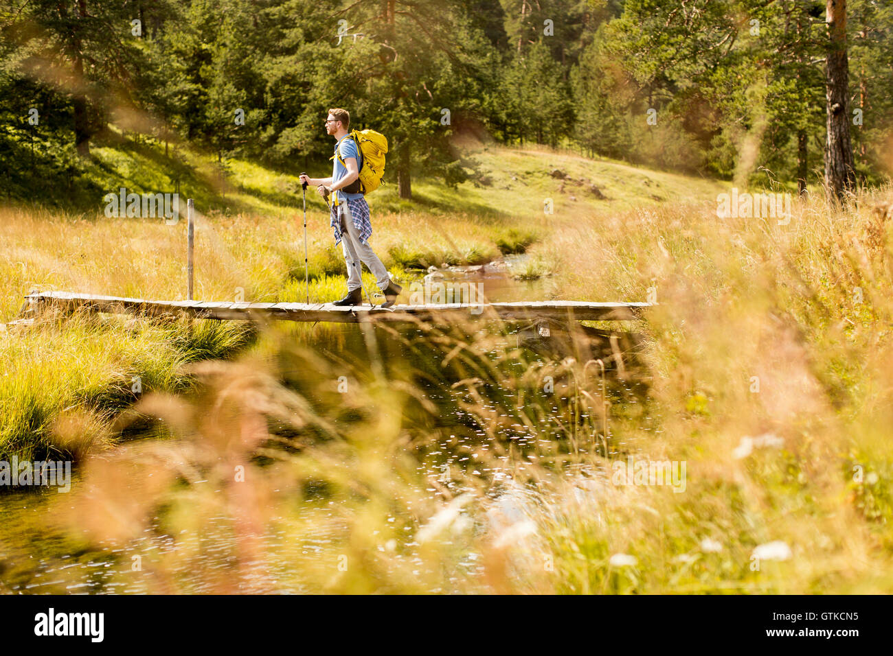Young man crosses mountain hi-res stock photography and images - Alamy