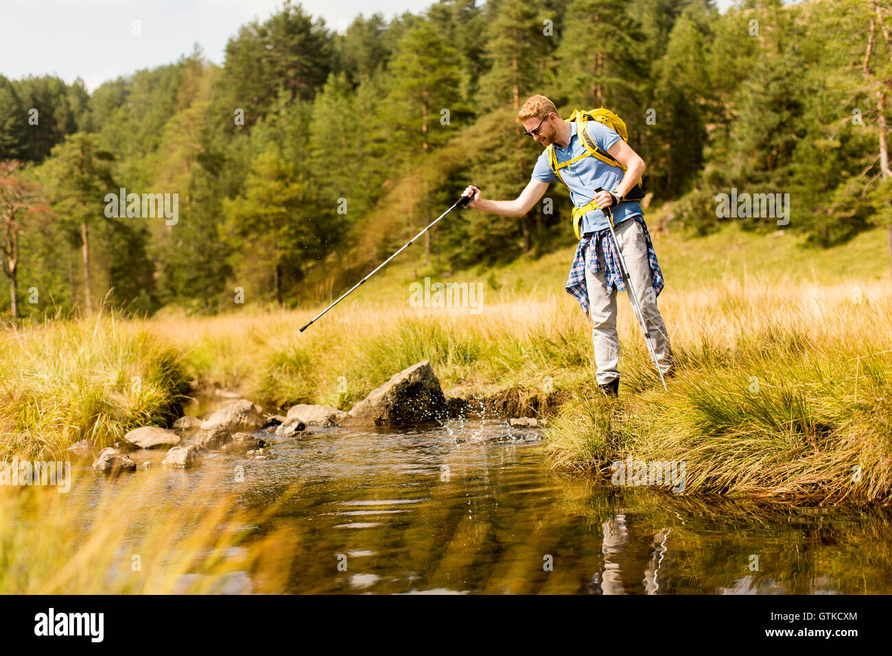 Young man crosses mountain hi-res stock photography and images - Alamy