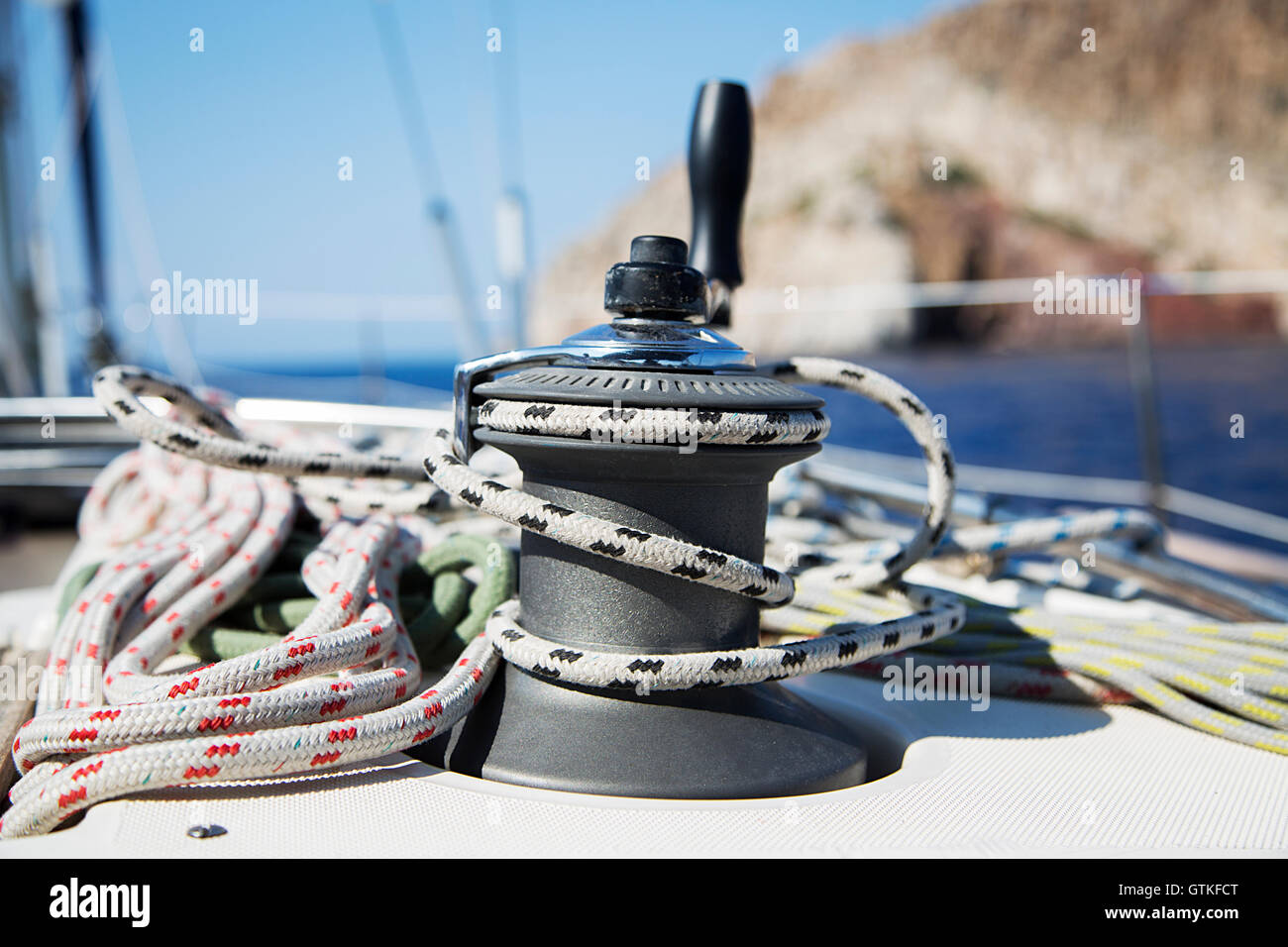 Young handsome sailor pulling rope on sailboat Stock Photo - Alamy