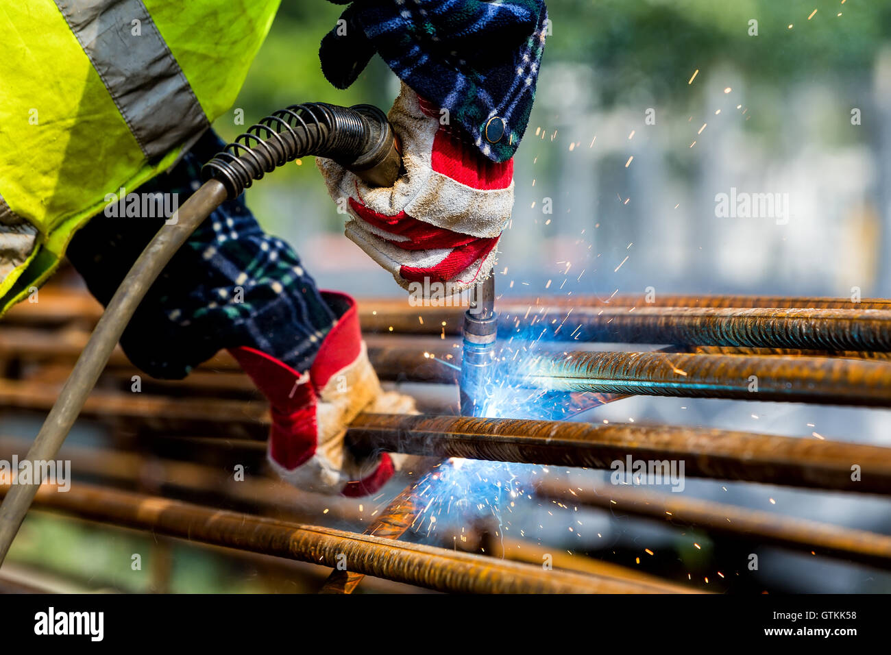 Close up of the hands welder worker with electrode. selective focus ...
