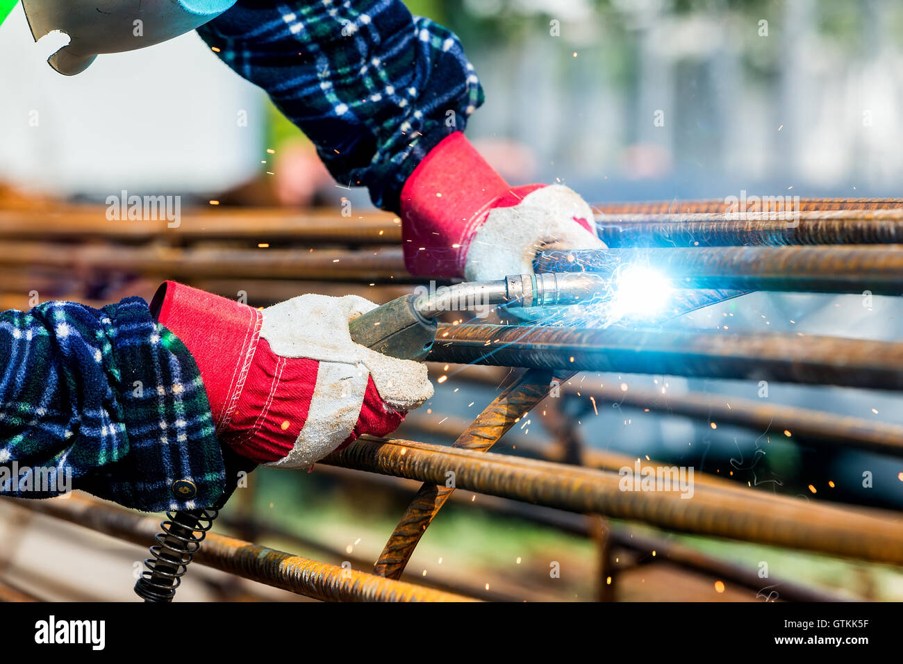 Close up of the hands welder worker with electrode. selective focus ...
