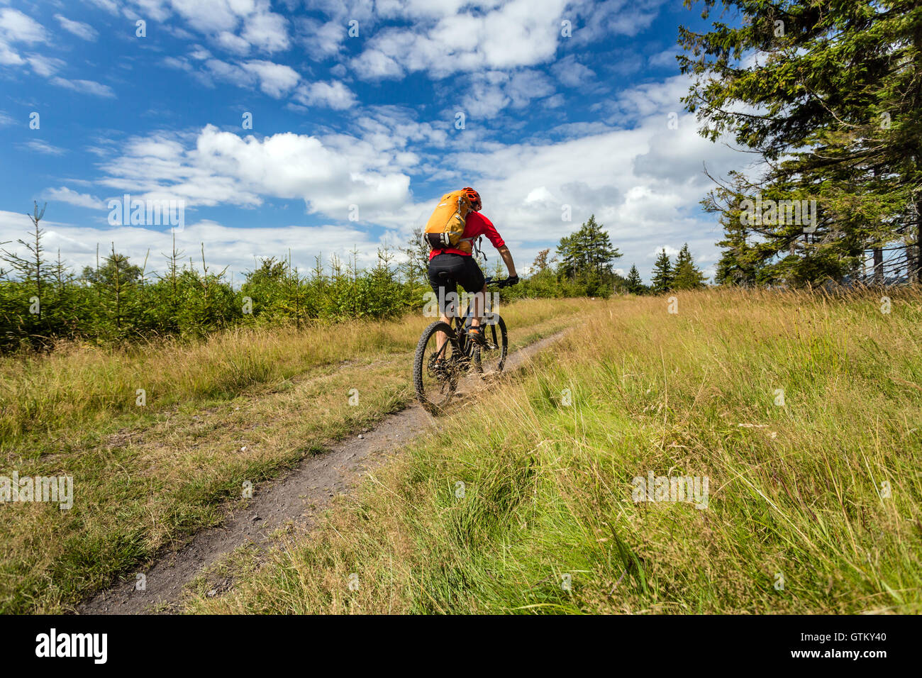 Mountain biker riding on bike in summer inspirational mountains ...