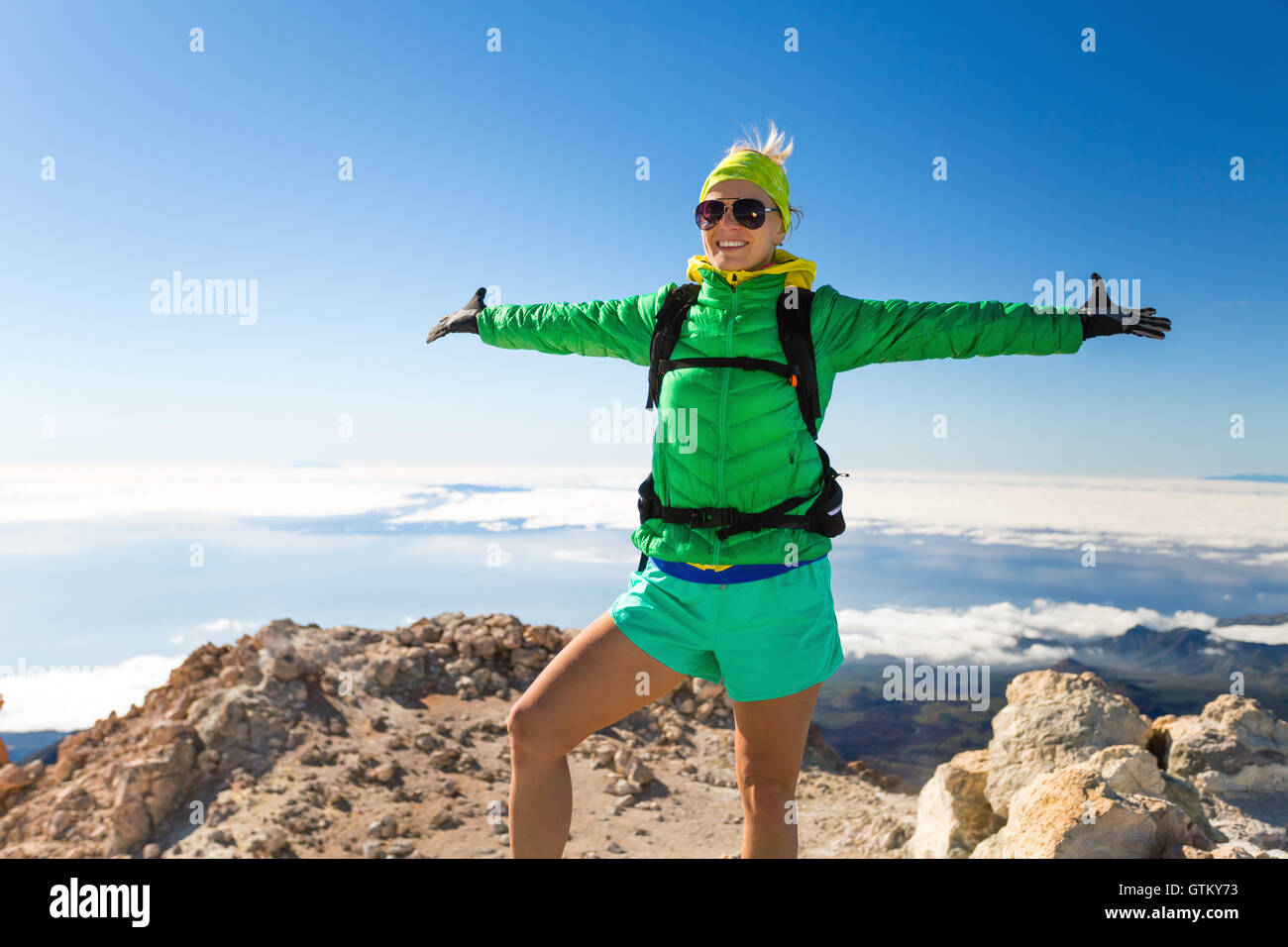 Woman successful hiking climbing in mountains, motivation and ...