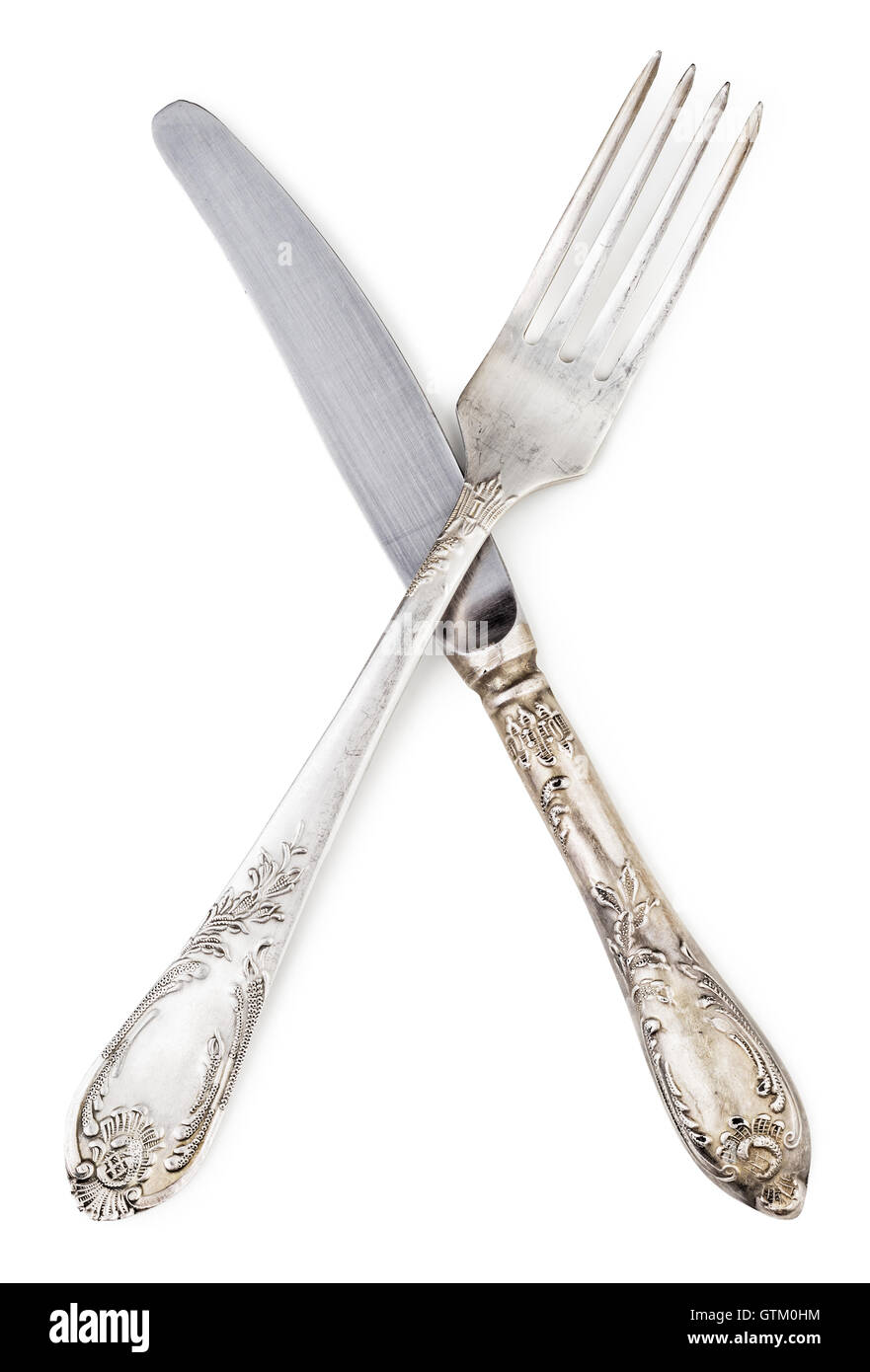 Old silver knife and fork crossed, isolated on white background Stock ...