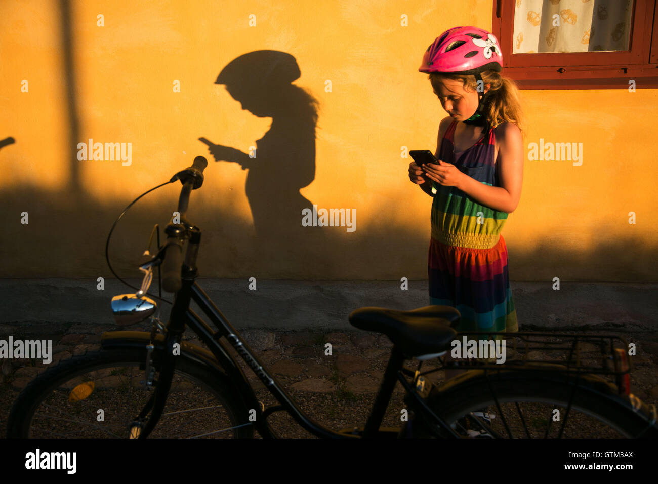 A young girl is chasing pokemons around Landskrona citadel playing ...