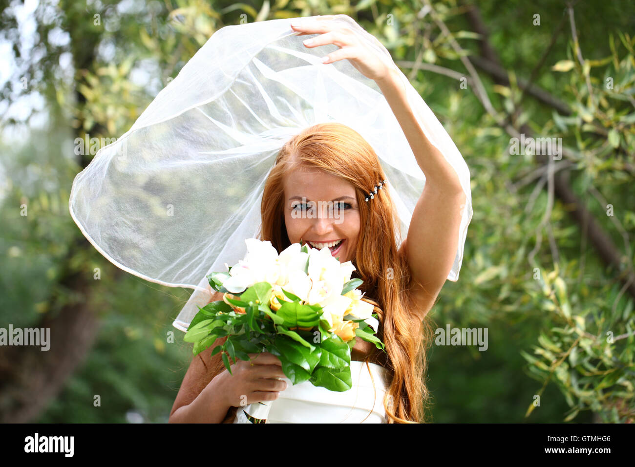 Beautiful red hair bride wearing wedding dress Stock Photo - Alamy